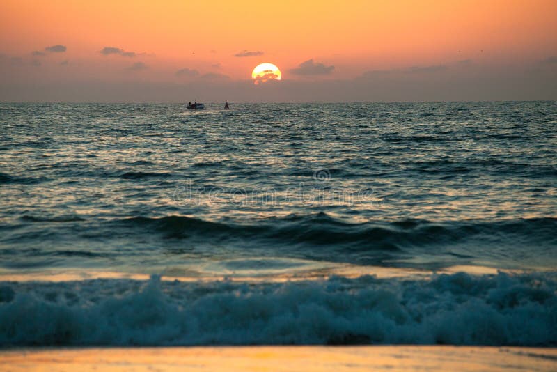 Sunset on the GOA beach stock image. Image of mountains - 61016011