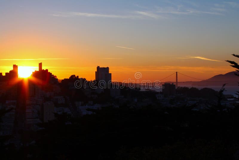 The Sunset with the Golden Gate and the Buildings Stock Image - Image ...