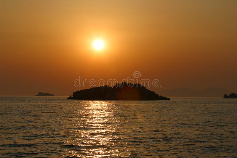Sunset in Greece with Ocean and Greek Islands Stock Photo - Image of ...