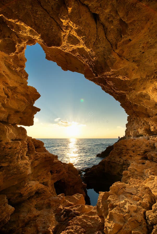 Sunset into grotto stock photo. Image of breeze, leaves - 16793900