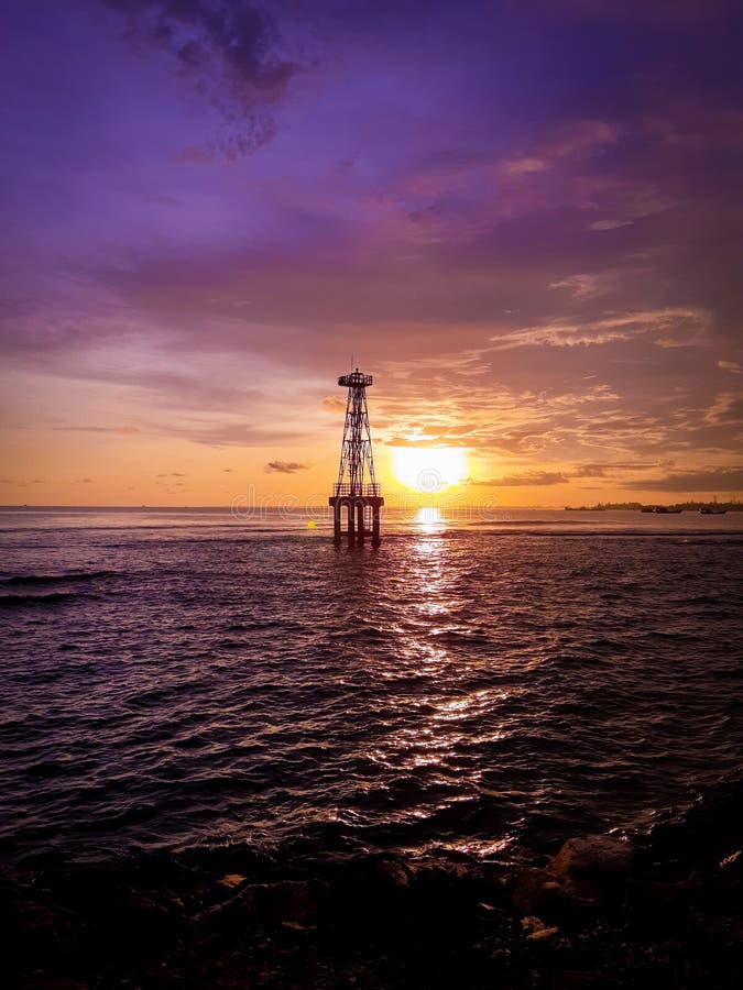 Sunset harbor beach stock image. Image of sunset, tower - 228900731
