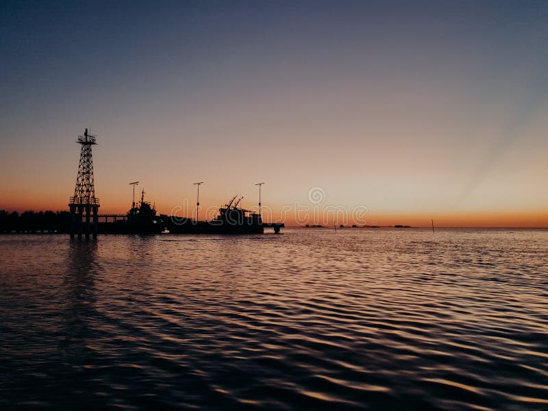 Sunset at harbour stock image. Image of sunlight, ocean - 180993557