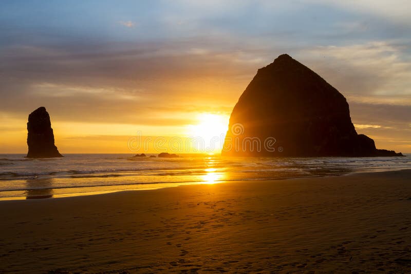 Sunset by Hastack Rock at Cannon Beach Along Oregon Coast Stock Image ...