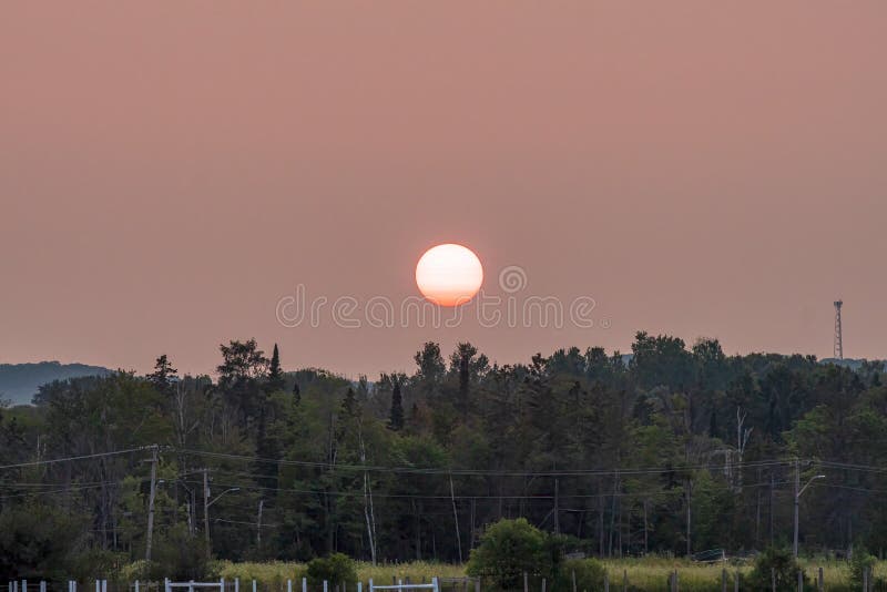 Sunset in haze stock photo. Image of reflection, afterglow - 266706008