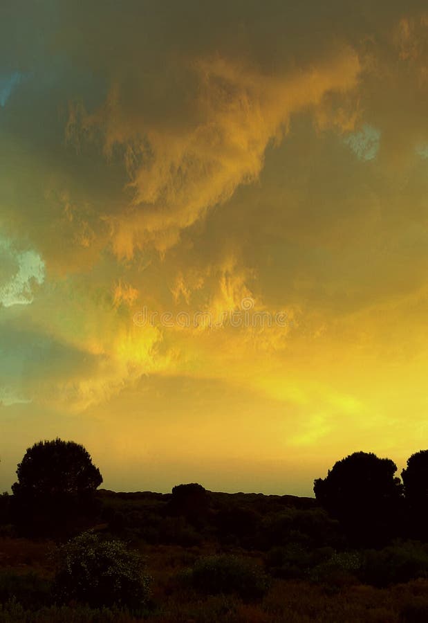 Sunset Hidden Behind a Mix of Different Cloud Colors Stock Image ...
