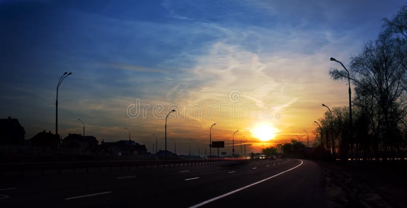 Sunset on highway stock photo. Image of motion, building - 13601460