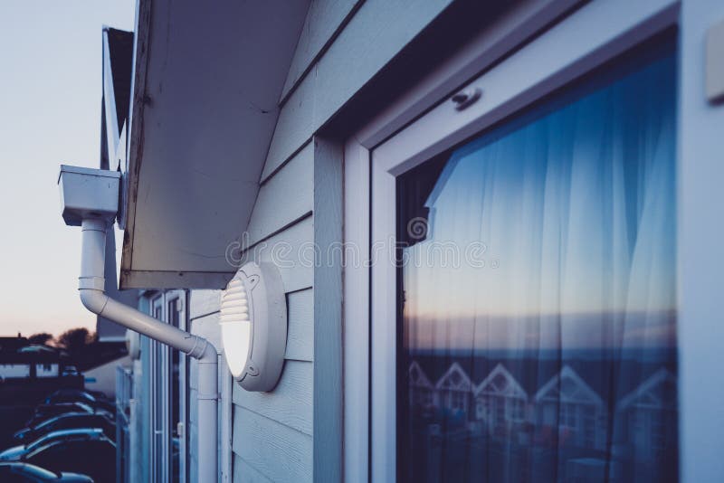 Sunset at a Holiday Resort Showing the Setting Sun on Patio Doors ...