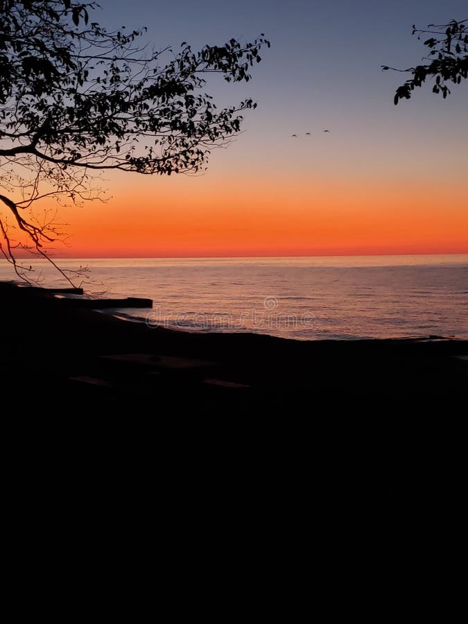 Sunset on the horizon stock image. Image of coast, sunrise - 232100963
