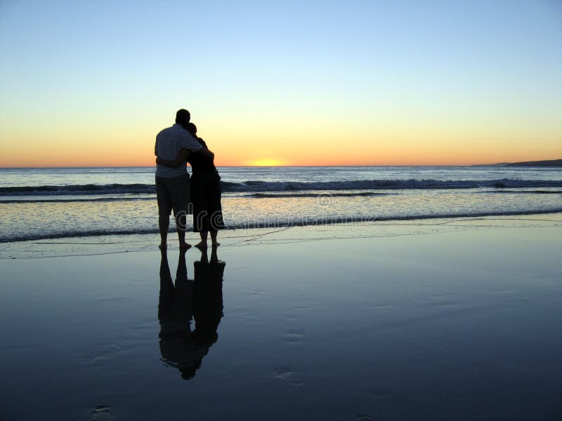 Sunset Hugs Reflected II stock photo. Image of away, leaning - 346516