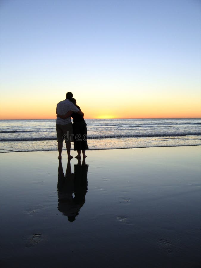 Sunset Hugs Reflected II stock photo. Image of away, leaning - 346516