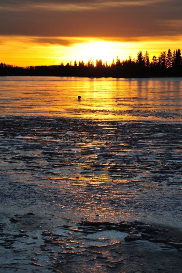 Sunset on ice lake stock image. Image of canadian, golden - 7283247