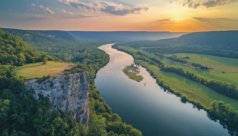 Sunset Illuminating River Winding through Green Valley with Cliff ...