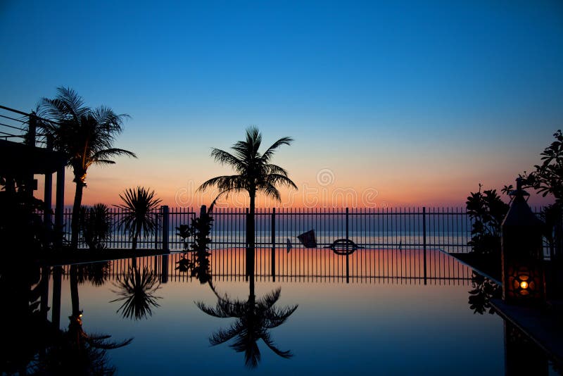 Sunset and infinity pool stock image. Image of jepara - 20283057