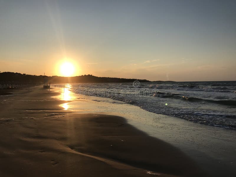 Sunset in Italy stock photo. Image of sunset, nice, wave - 122218278