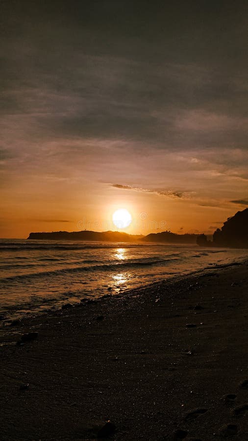 Sunset on the java beach stock image. Image of sunset - 225721673