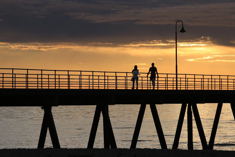 Sunset Jetty Stroll stock photo. Image of walk, sunset - 47610900