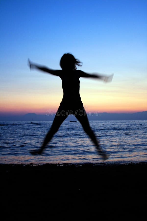 Sunset Jumping in the Sea Beach Stock Image - Image of star, sunset ...