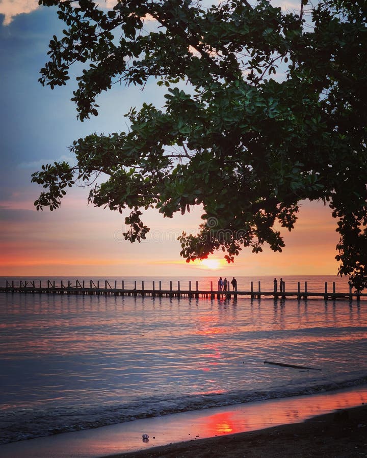 Sunset at Kastela Beach in Ternate Island Bridge in Top of the Sea ...