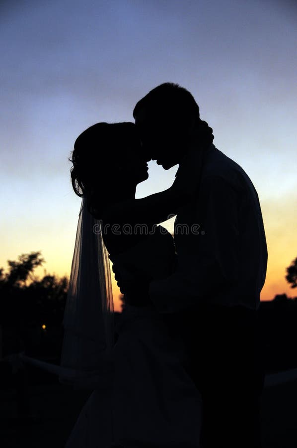 Sunset Kiss stock photo. Image of married, adults, happy - 9454102