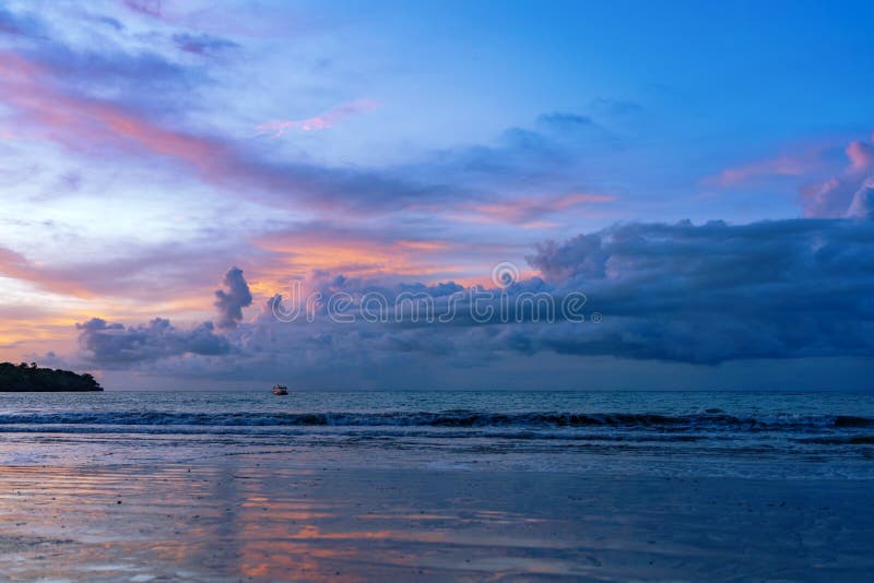 Sunset at Kuta Beach in Bali Stock Photo - Image of beach, mountain ...