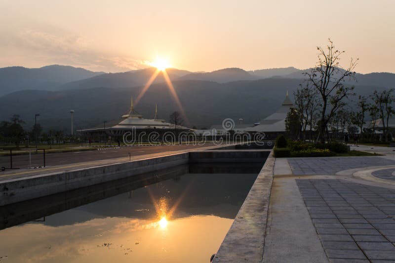 Sunset Lagoon with Building and Mountain Stock Image - Image of clound ...