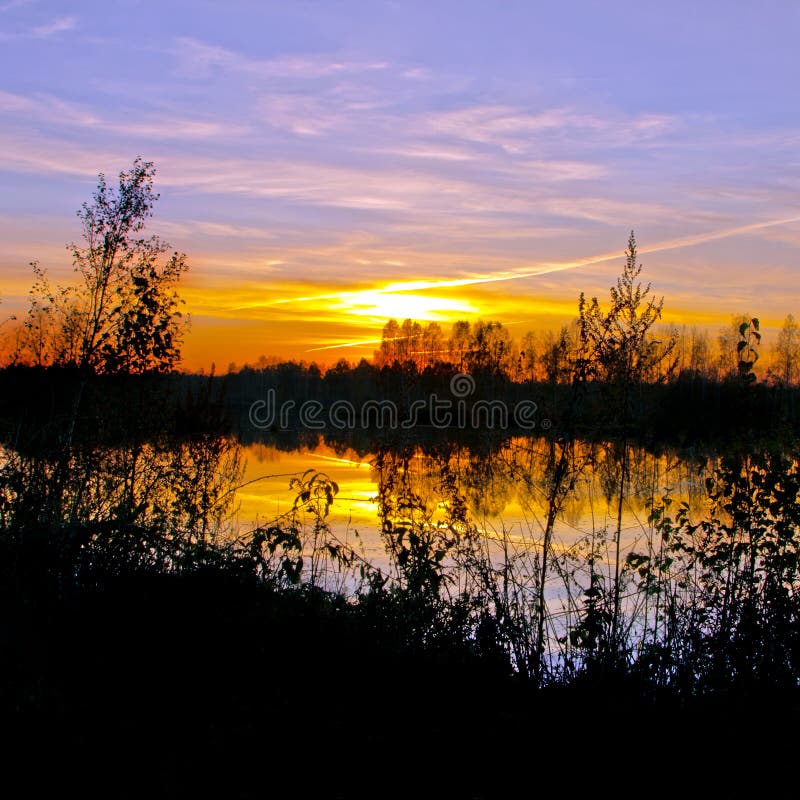 Sunset on lake stock photo. Image of reflection, clouds - 20627830