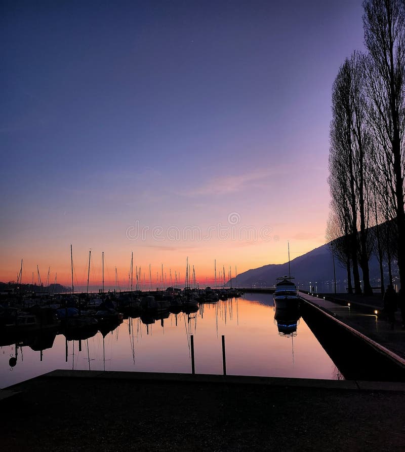 Sunset on the lake biel stock image. Image of boats - 290860177