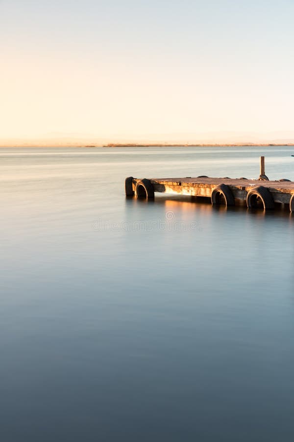Sunset on a Lake with an Empty Jetty and Feeling of Calm Stock Image ...