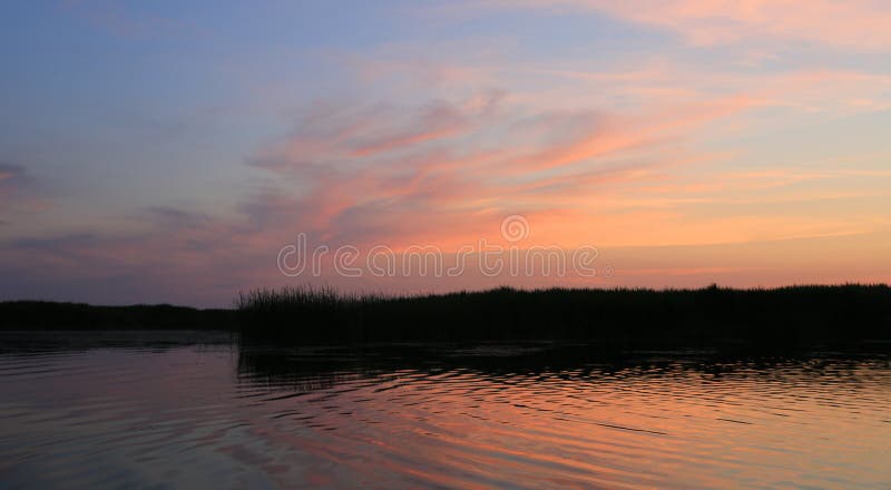 Red sunset on lake stock photo. Image of cloudy, sunrise - 12661050