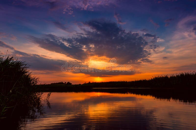 Red sunset on lake stock photo. Image of cloudy, sunrise - 12661050