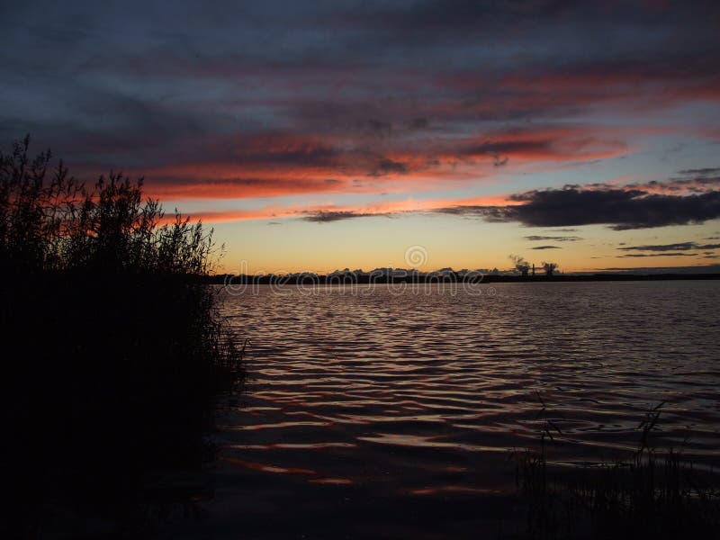 Sunset on the Lake and Reed in the Background Distant Shore Stock Photo ...