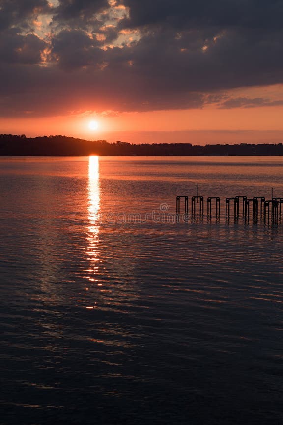 Sunset at the Lake with Reflections from the Sinking Sun Stock Photo ...