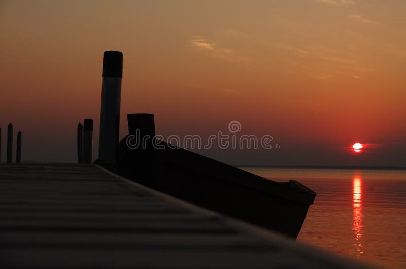 Sunset on the lake stock image. Image of serene, cane - 47873833