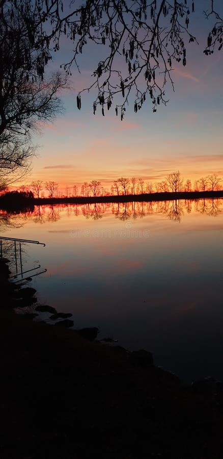 Lake Sunset stock image. Image of trees, lake, sunset - 152775499