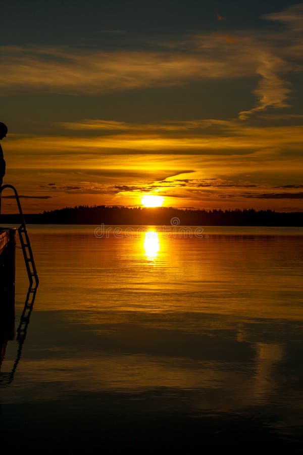 Sunset at the lake Unden stock photo. Image of vacation - 245972220