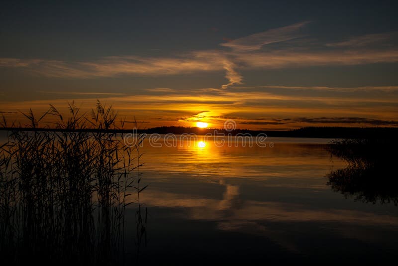 Sunset at the lake Unden stock photo. Image of wood - 245972358