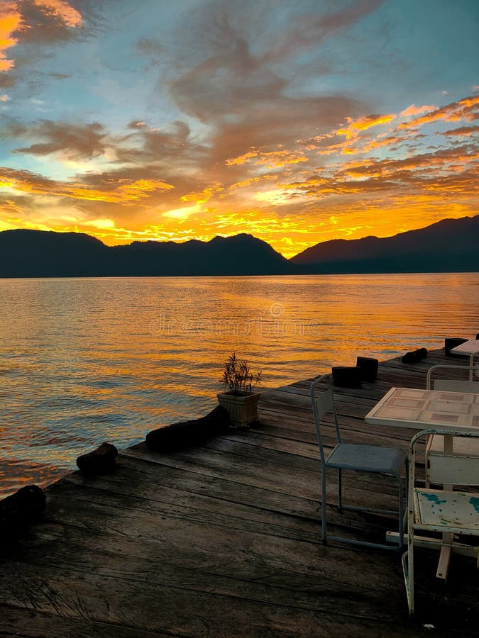 Sunset at lakeside stock image. Image of chair, lakeside - 261766981