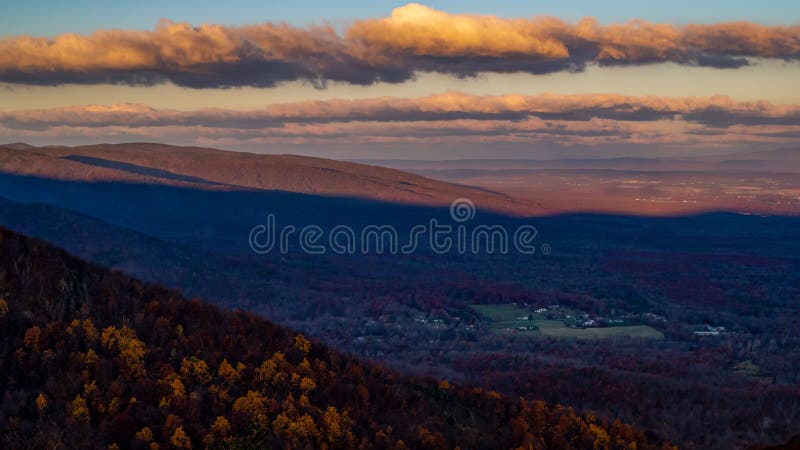 Sunset Landscape of an Autumn Forest with Buildings Hidden in Trees on ...