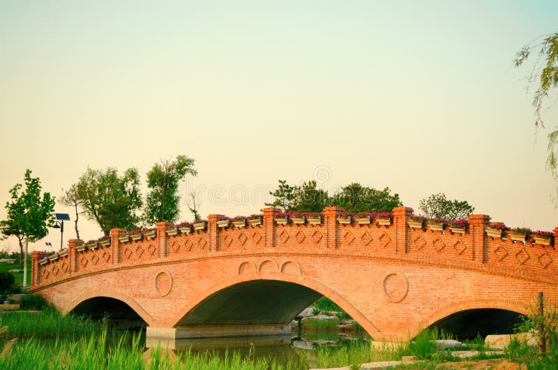 Sunset Landscape with Brick Arch Bridge Stock Photo - Image of rock ...