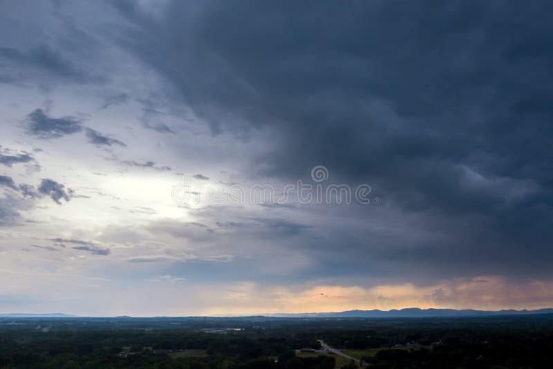 During Sunset, a Dramatic Panorama Shows Storm Clouds in the Sky Stock ...