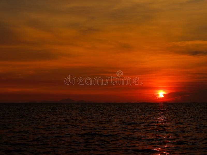 Sunset Last on Horizontal in Right Frame Over Orange Sky and Ocean ...