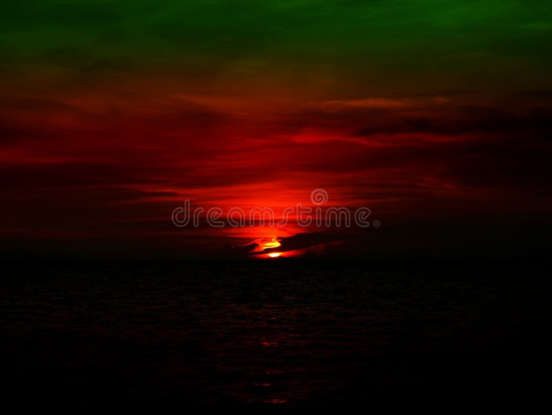 Sunset Last Light of Sun on Horizontal Line Over Dark Green Sky Stock ...