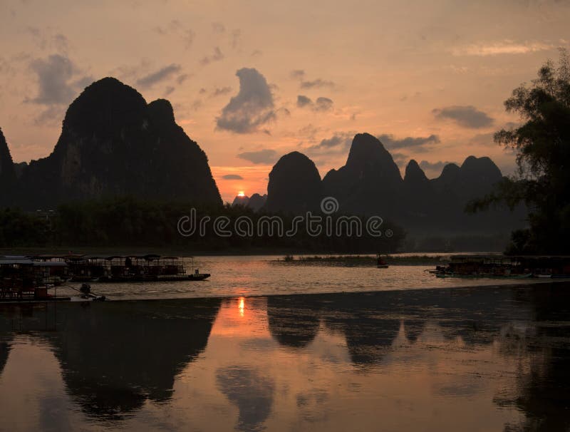 Sunset at li river guangxi stock image. Image of water - 49182685
