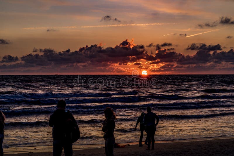 KLAIPEDA, LITHUANIA - AUGUST 19, 2017: Sunset Light with People and ...