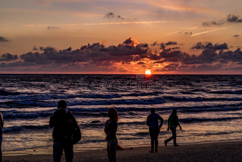 KLAIPEDA, LITHUANIA - AUGUST 19, 2017: Sunset Light with People and ...