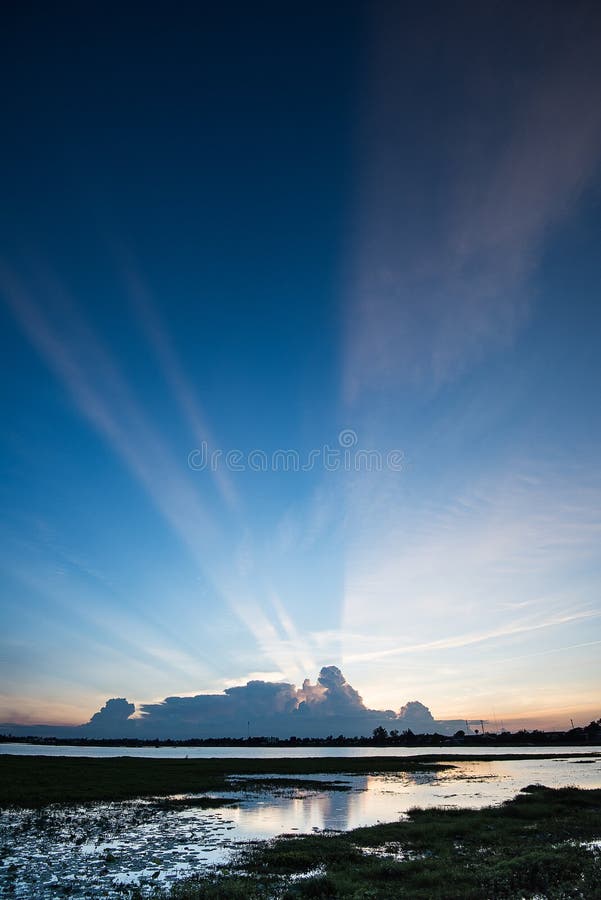 Sunset with Light Streaks and Half of Sky Lit by Setting Sun Stock ...