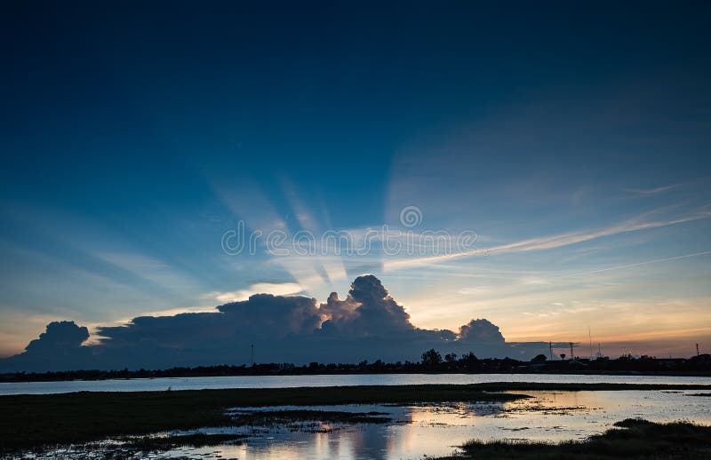 Sunset with Light Streaks and Half of Sky Lit by Setting Sun Stock ...
