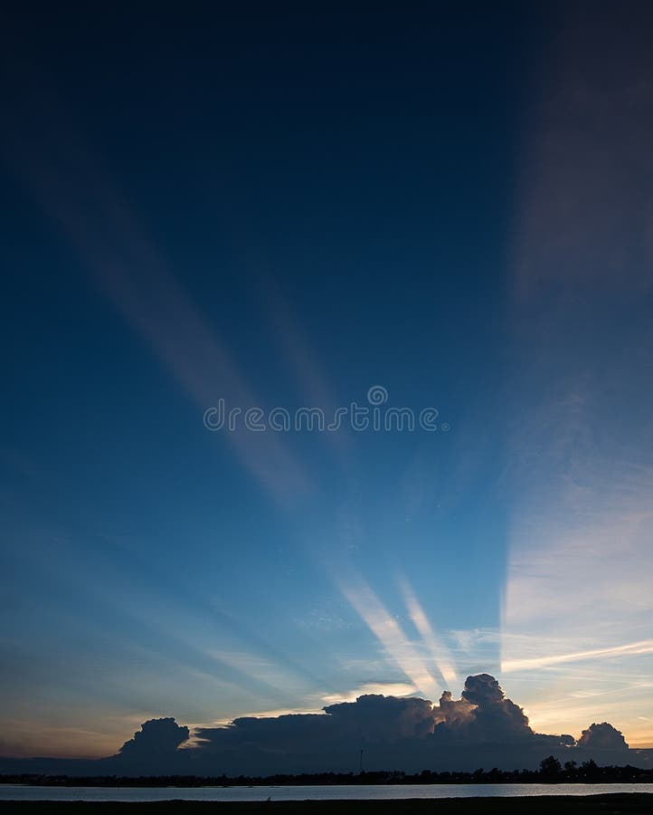 Sunset with Light Streaks and Half of Sky Lit by Setting Sun Stock ...