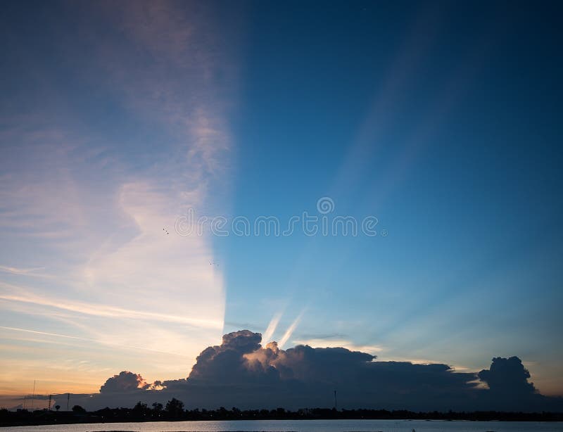 Sunset with Light Streaks and Half of Sky Lit by Setting Sun Stock ...