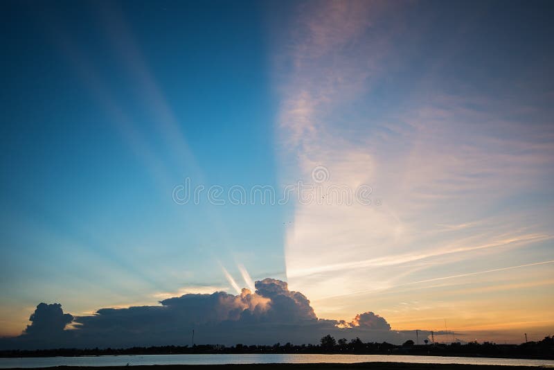 Sunset with Light Streaks and Half of Sky Lit by Setting Sun Stock ...